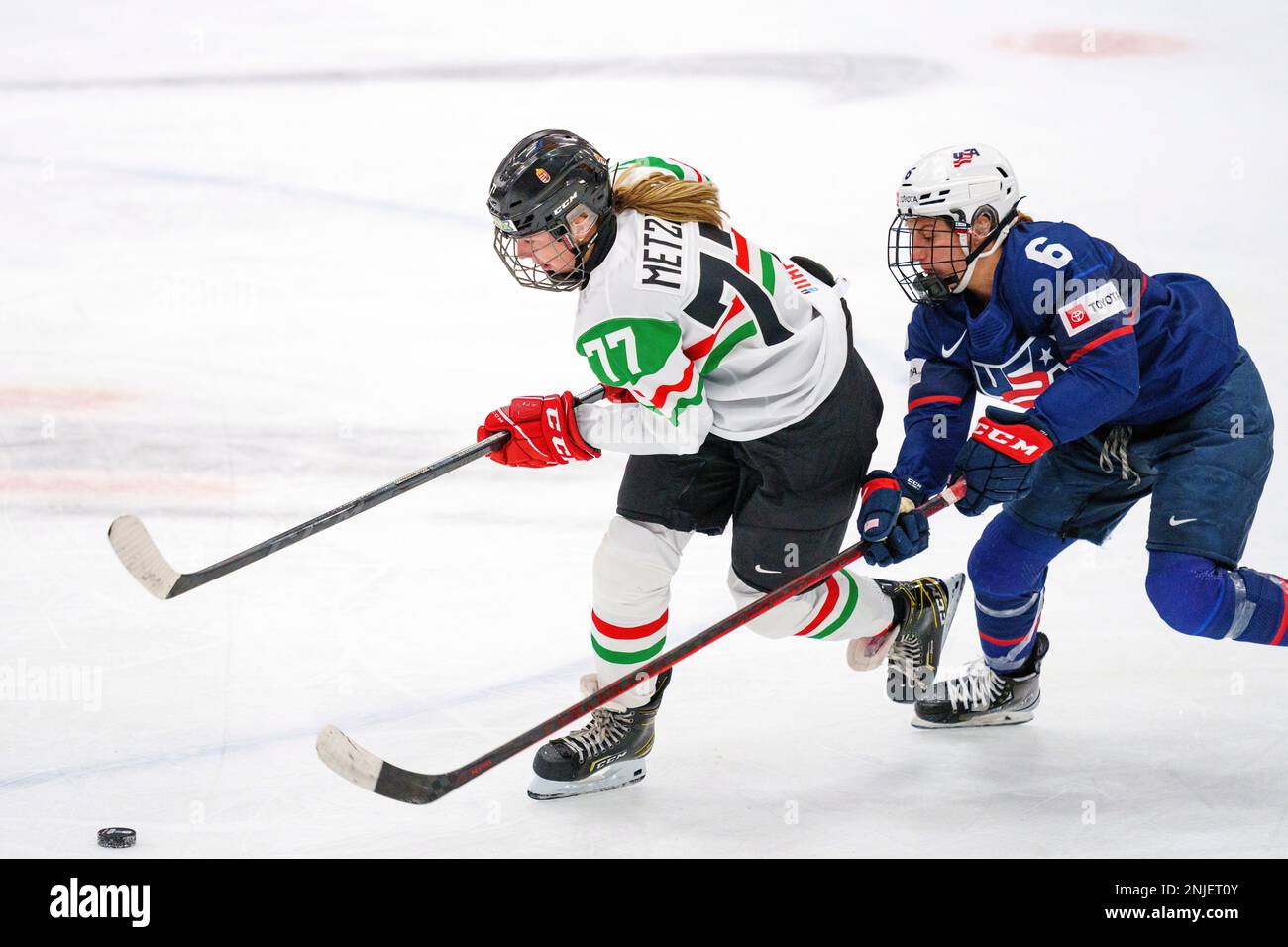 Regina Metzler of Hungary in action with Lacey Eden of USA during The IIHF World Championship ...
