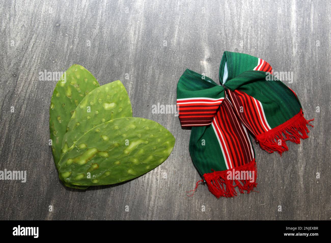 Festive Mexican objects: handmade doll and tricolor tie bow next to ...