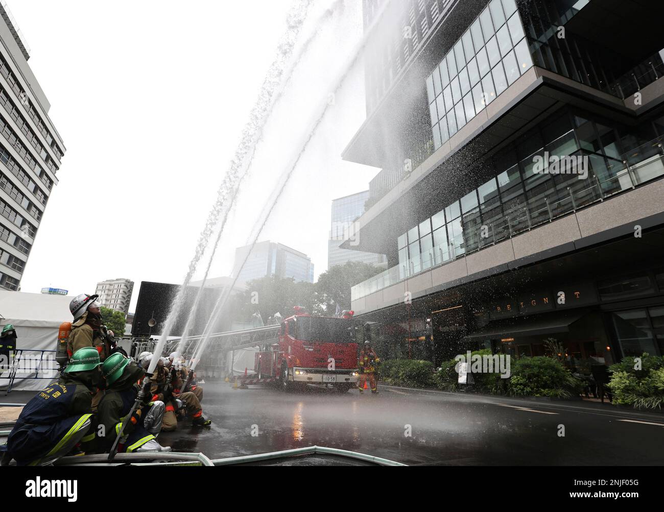A disaster drill is held at an office area in Chiyoda ward, Tokyo on ...