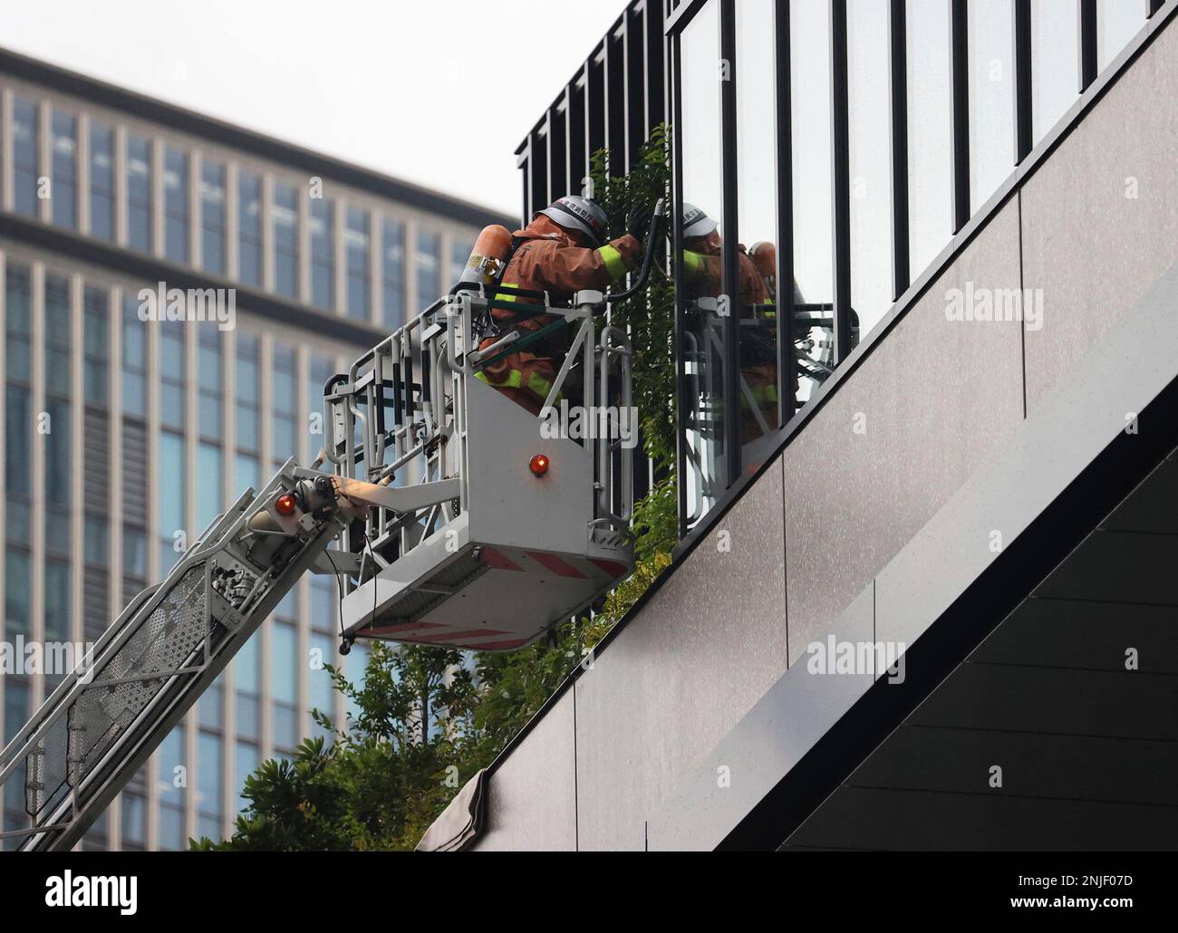 A disaster drill is held at an office area in Chiyoda ward, Tokyo on ...