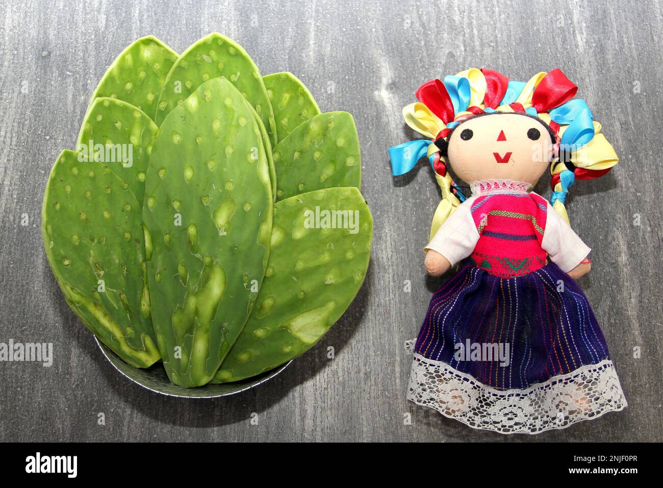 Festive Mexican objects: handmade doll and tricolor tie bow next to ...