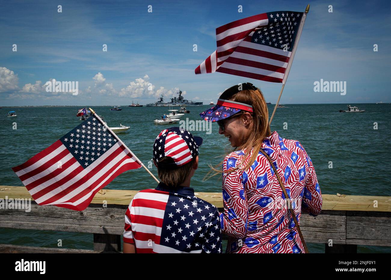 Kim Batson talks to her son Maxim, 11, as the USS Texas, commonly known ...