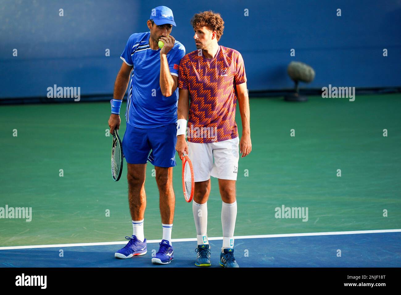 Robin Haase and Philipp Oswald during a men's doubles match at the 2022 ...