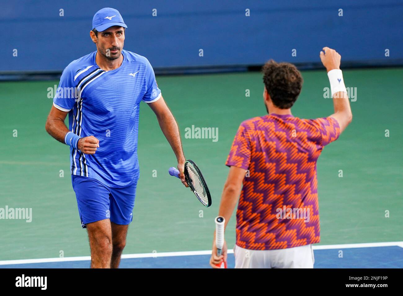 Robin Haase and Philipp Oswald during a men's doubles match at the 2022 ...