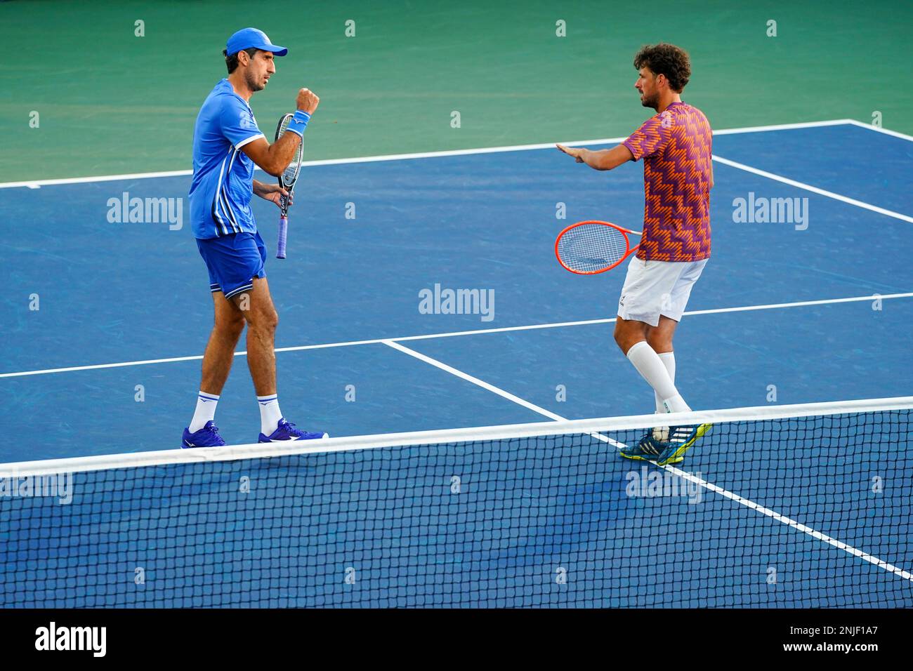 Robin Haase and Philipp Oswald during a men's doubles match at the 2022 ...
