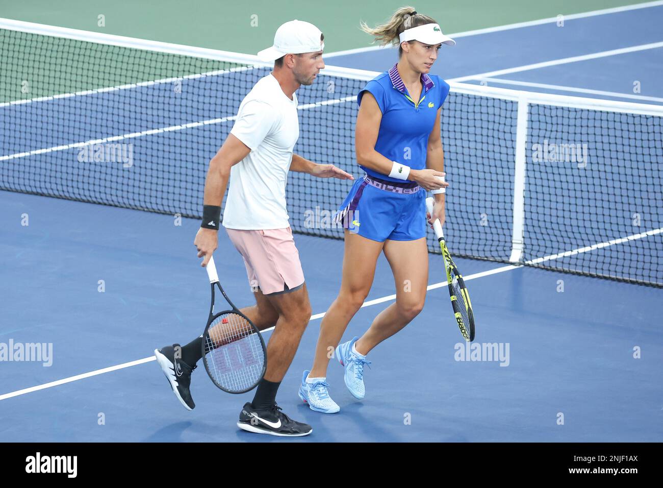 Jackson Withrow and Bernarda Pera in action during a mixed doubles ...