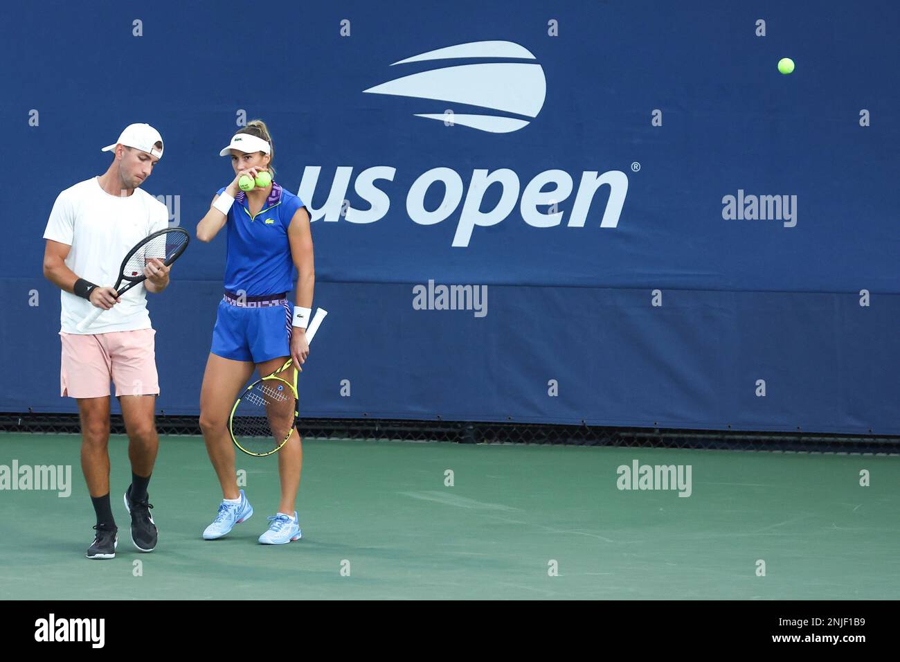Jackson Withrow and Bernarda Pera in action during a mixed doubles ...