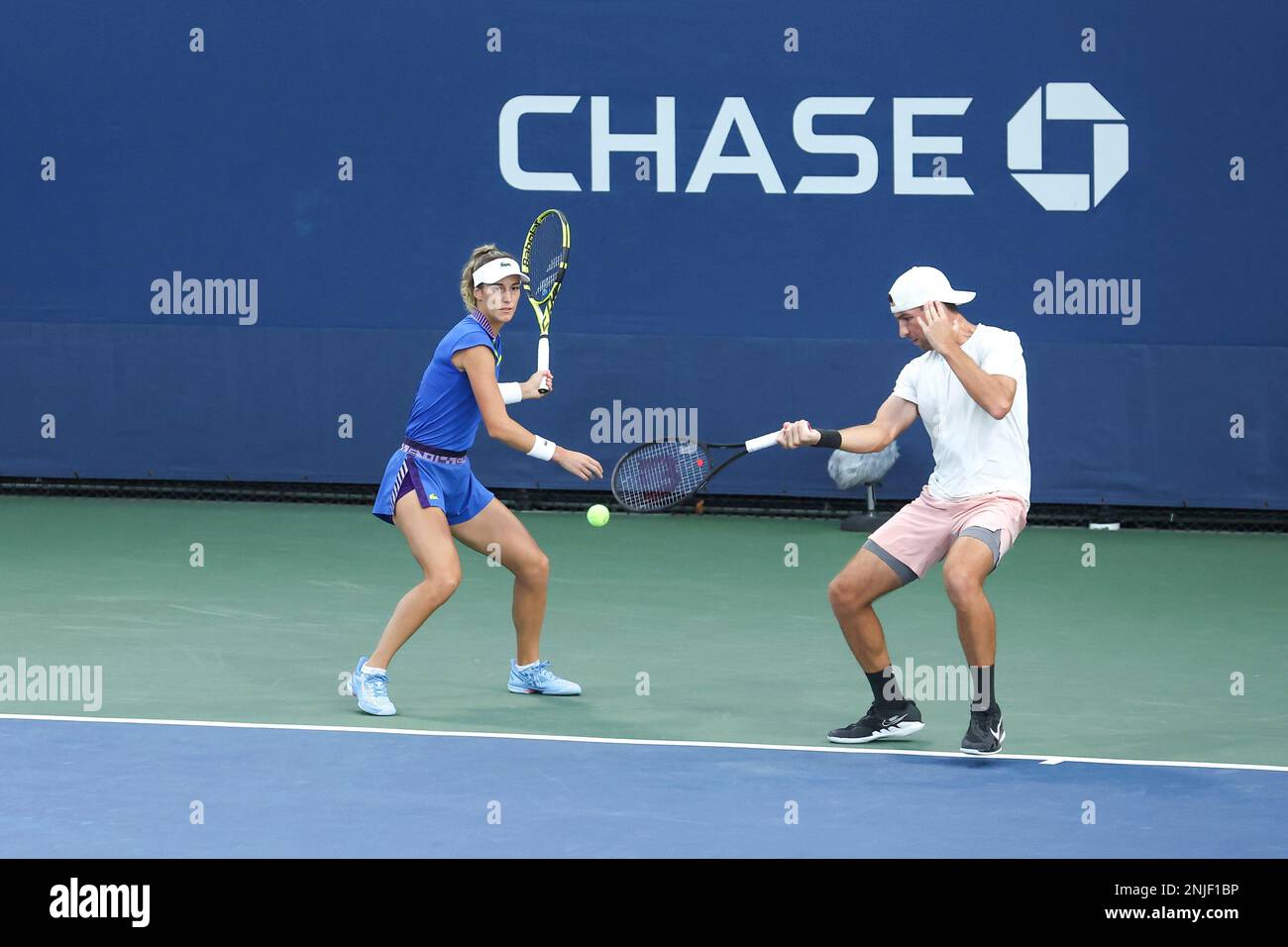 Jackson Withrow and Bernarda Pera in action during a mixed doubles ...