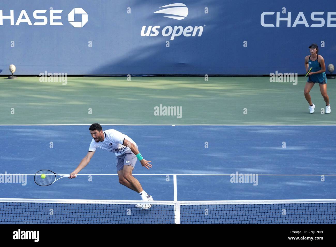 Franko Skugor and Ena Shibahara celebrate during a mixed doubles match ...