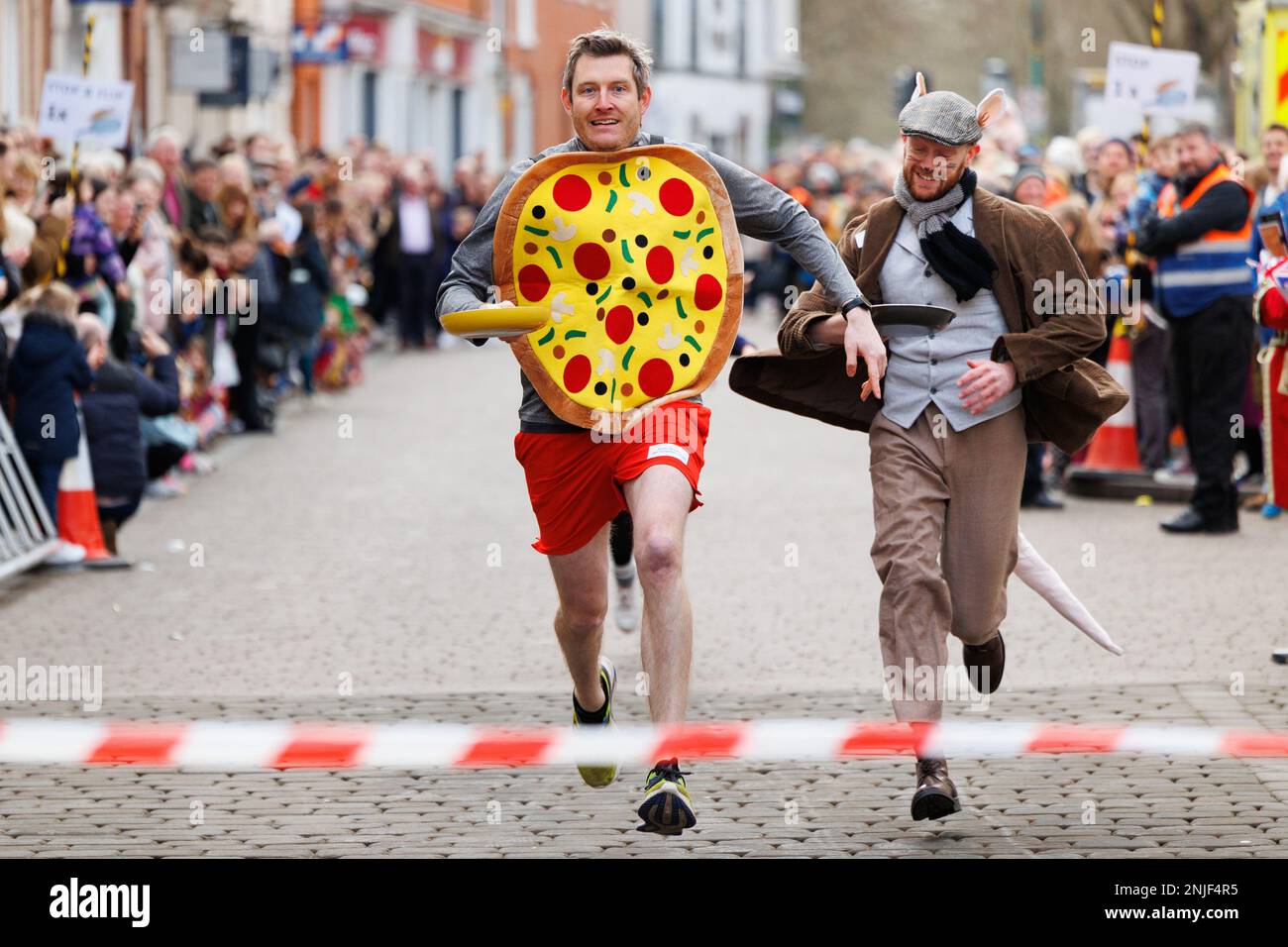 The annual Shrove Tuesday pancake race held in Lichfield, Staffordshire ...