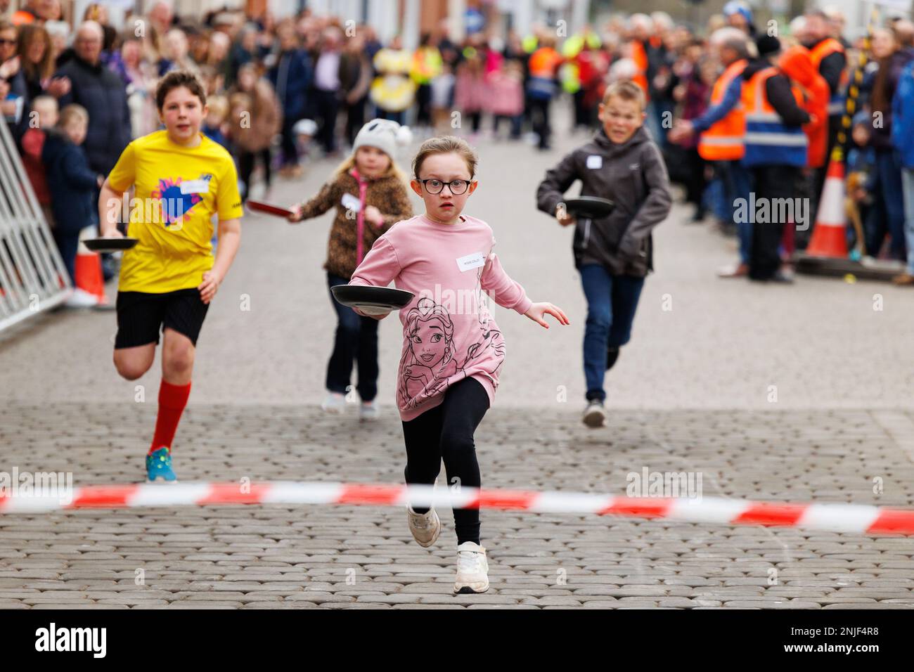 The annual Shrove Tuesday pancake race held in Lichfield, Staffordshire ...