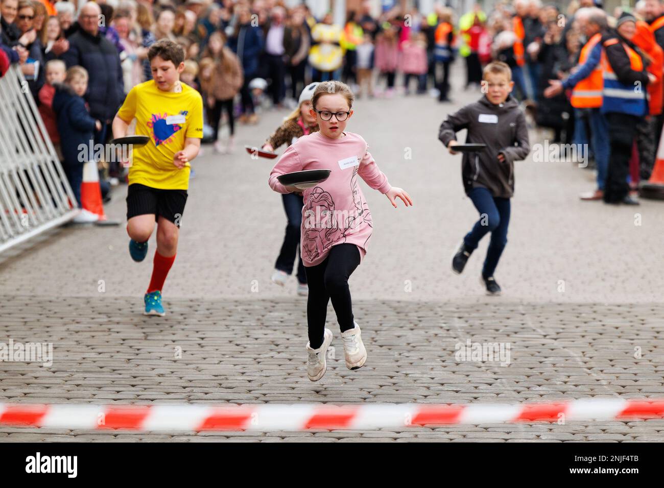The annual Shrove Tuesday pancake race held in Lichfield, Staffordshire ...