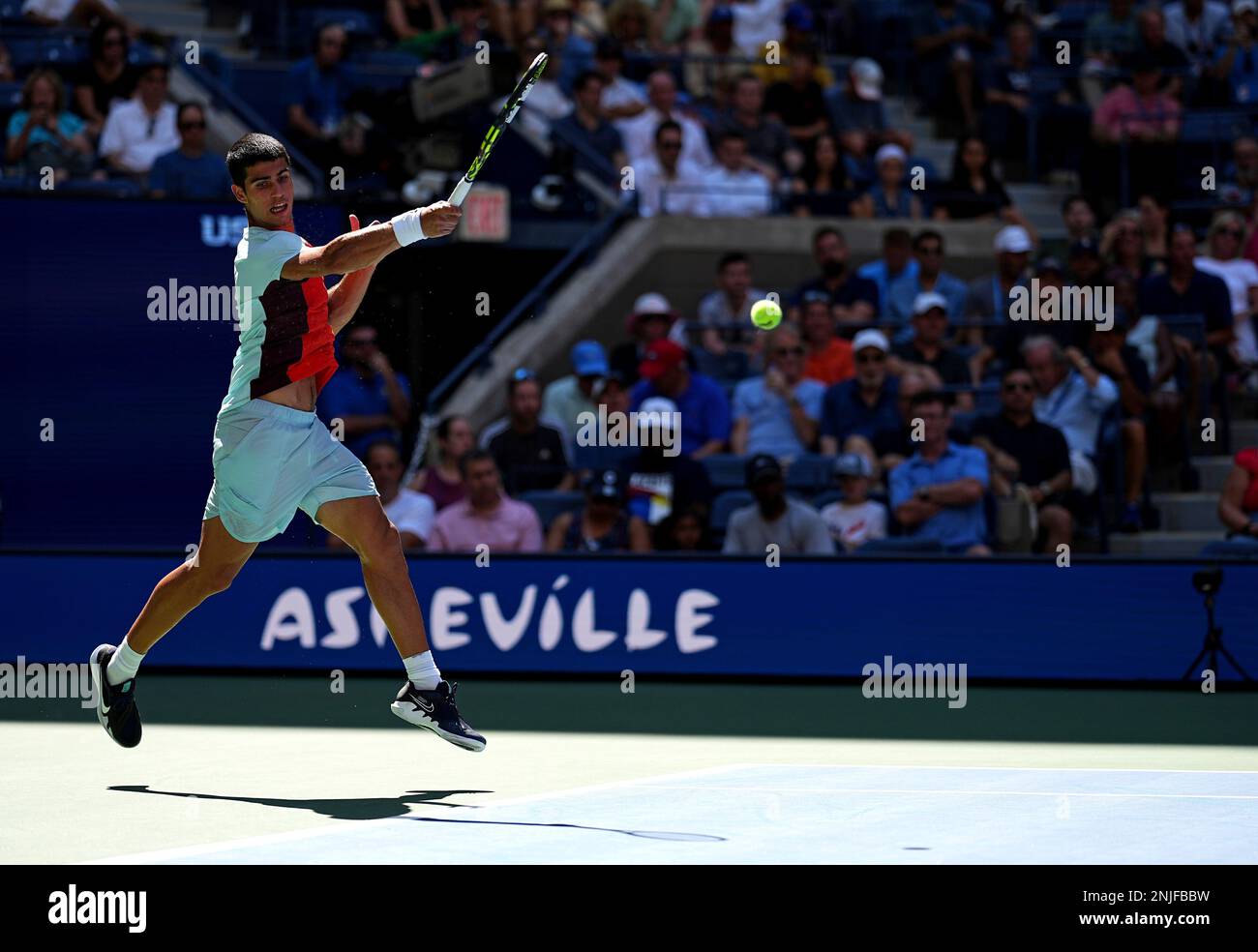 Carlos Alcaraz hits a forehand during a men's singles match at the 2022 ...
