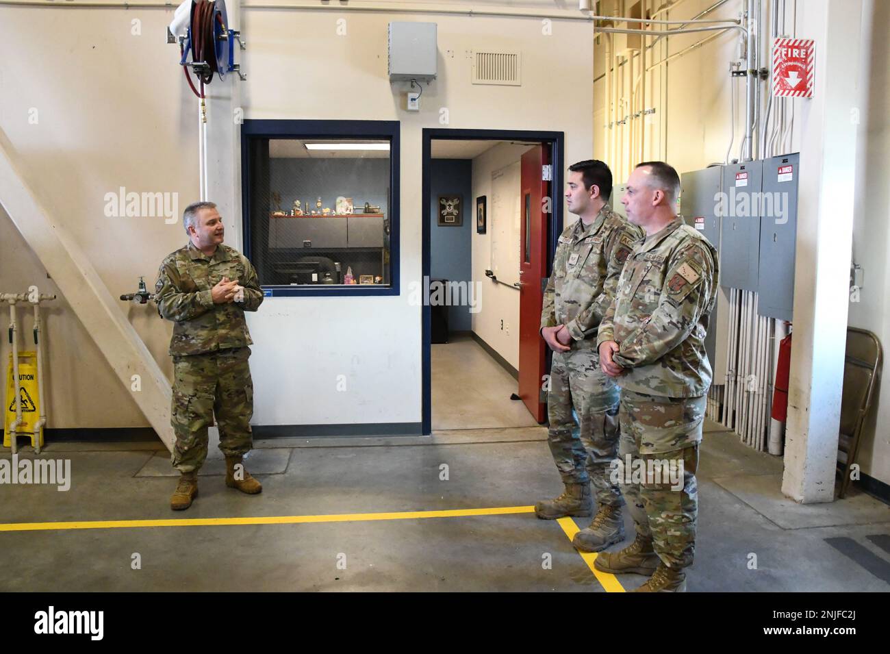Tech. Sgt. Benjamin Fifer, right, and Staff Sgt. Trevor Correa, center ...