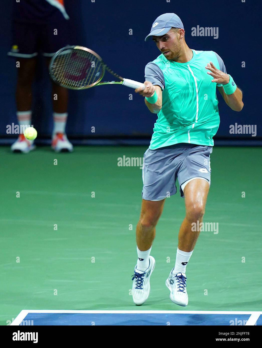 Benjamin Bonzi returns during a men's singles match at the 2022 US Open ...