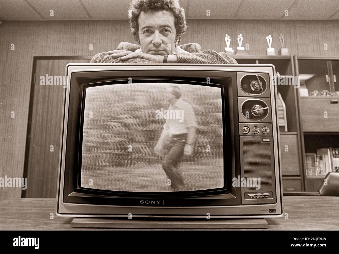 Carter advisor, advertising executive, Gerald Rafshoon perches on a tv ...
