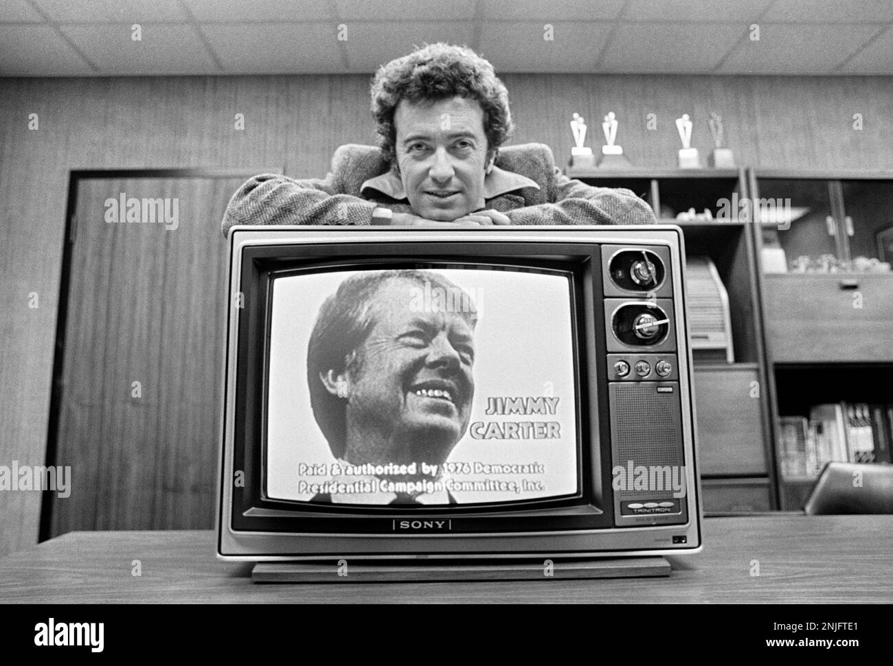 Carter advisor, advertising executive, Gerald Rafshoon perches on a tv ...