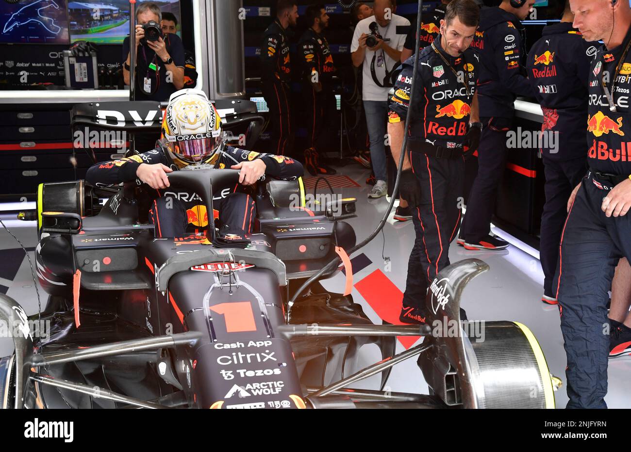 Red Bull driver Max Verstappen of the Netherlands gets into his car ...