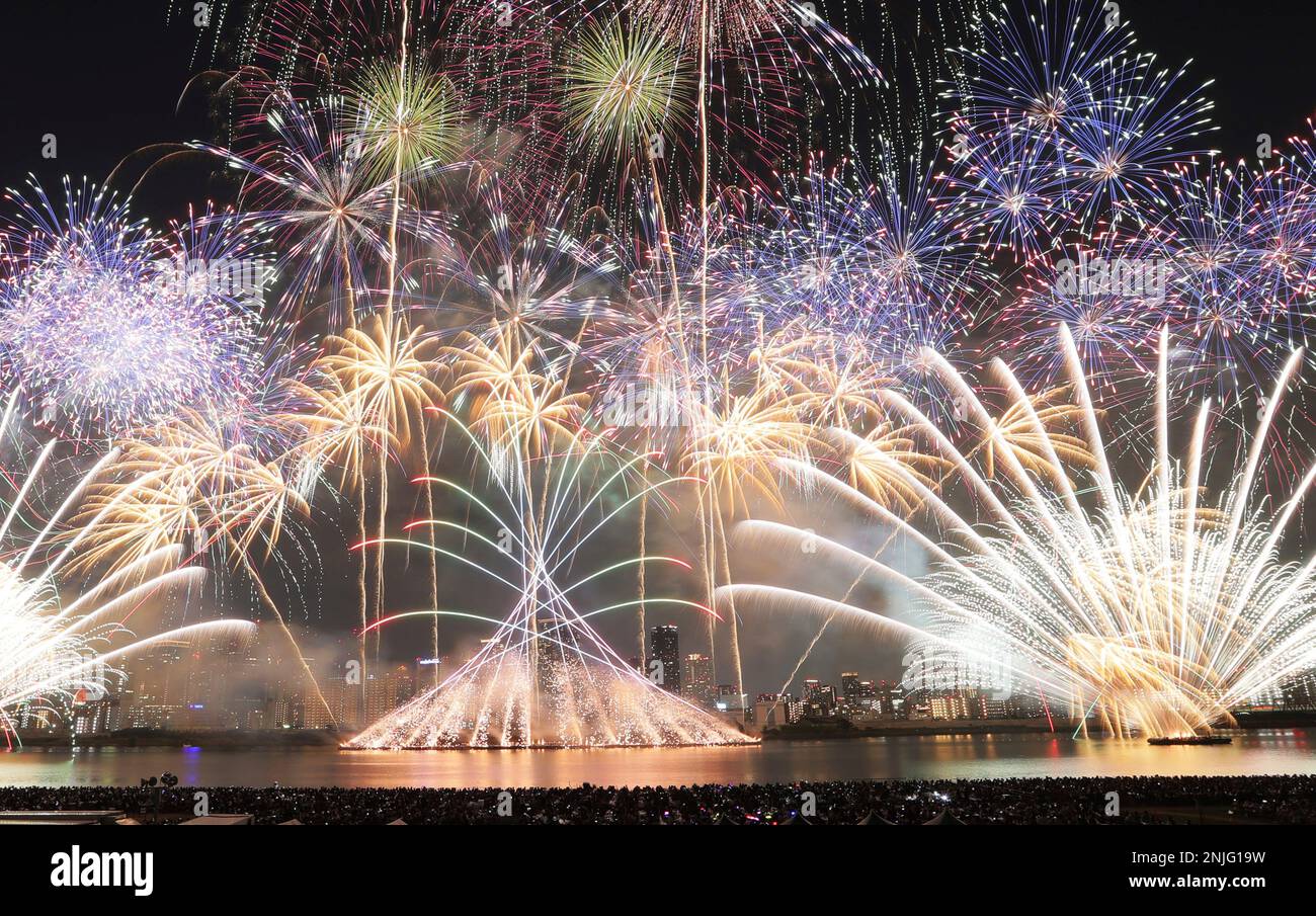 Pyrotechnicians perform their hanabi, fireworks during the Naniwa ...
