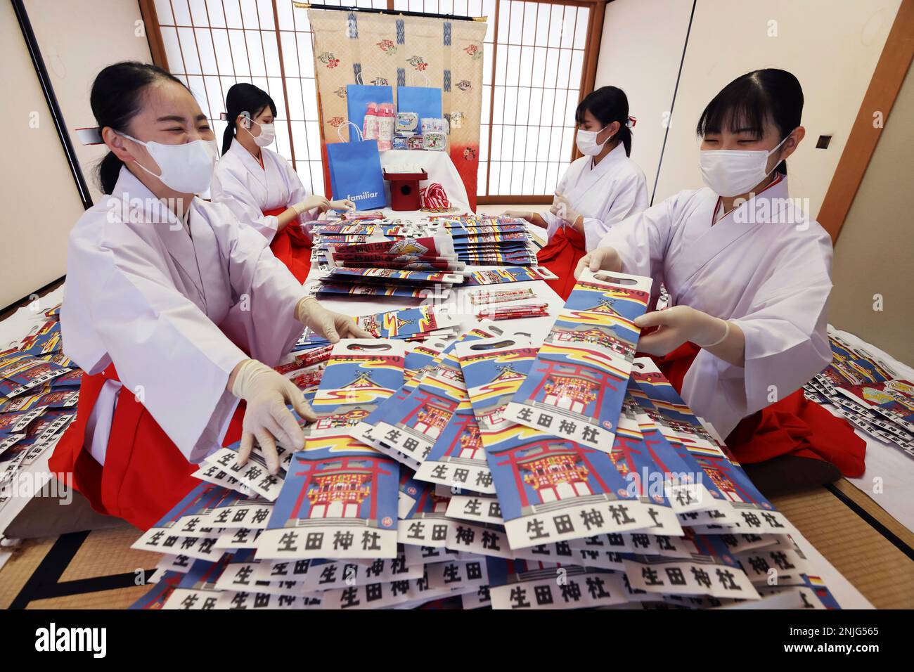 Shrine maiden pack chitose ame (candy) for children at a shrine in Kobe ...
