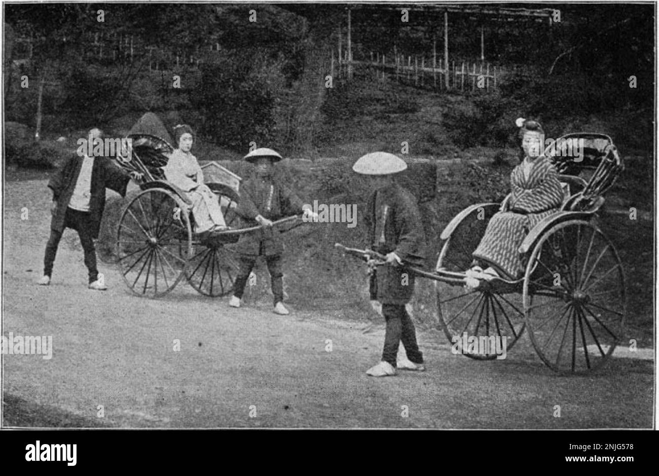 an old photo representing two Japanese rickshaws Stock Photo - Alamy