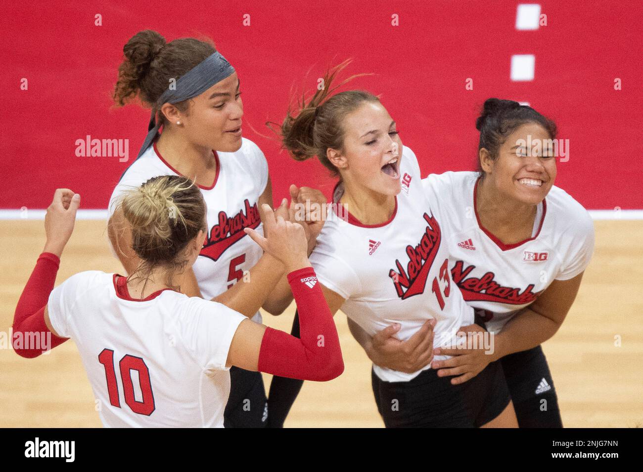 Nebraska's Whitney Lauenstein, second from right, is held by Kennedi ...