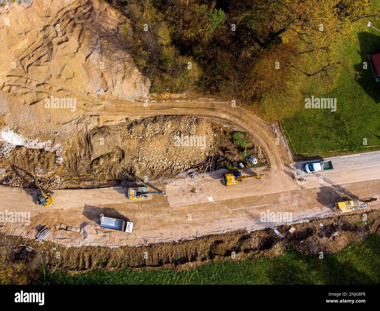Aerial view of a road construction / rebuild on a mountain pass. Side ...