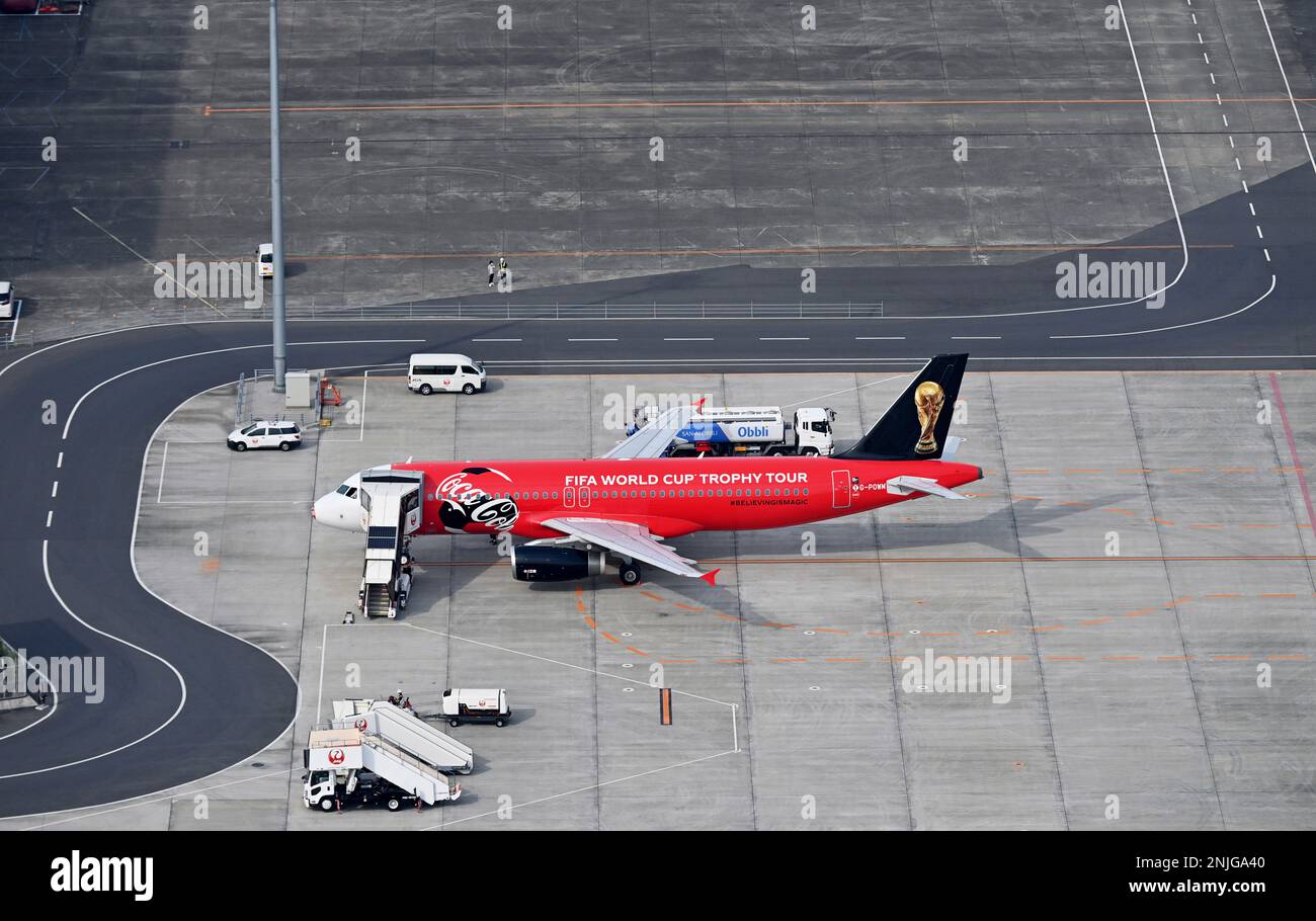 A specially decorated airplane of the FIFA World Cup Trophy Tour parks ...