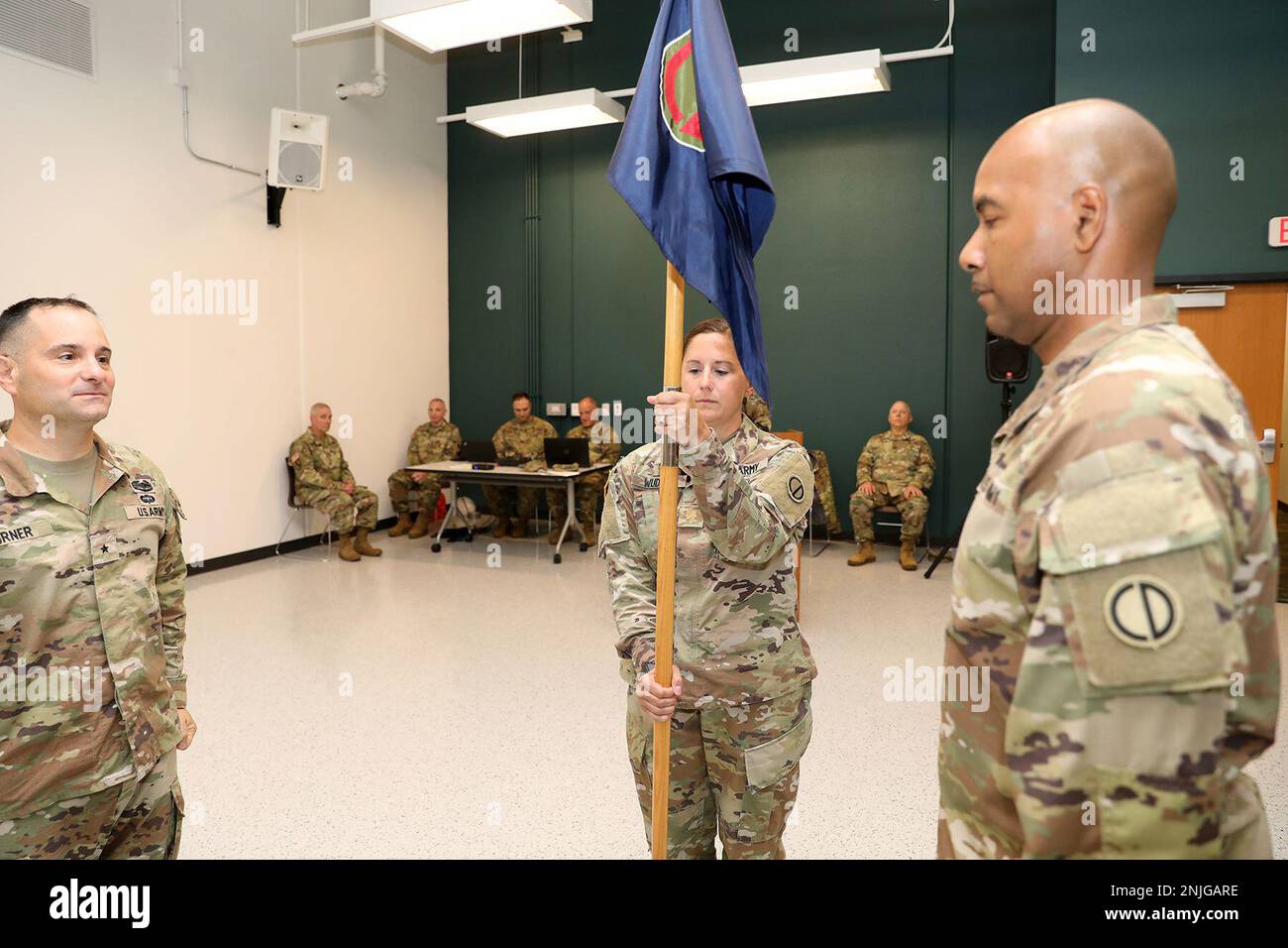 Maj. Kristin J. Wudtke, center, incoming headquarters and headquarters ...