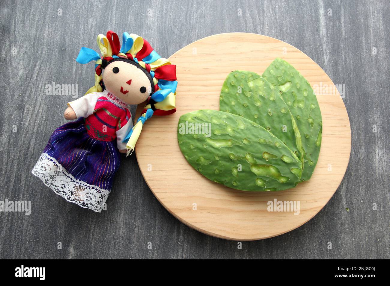 Festive Mexican objects: handmade doll and tricolor tie bow next to ...
