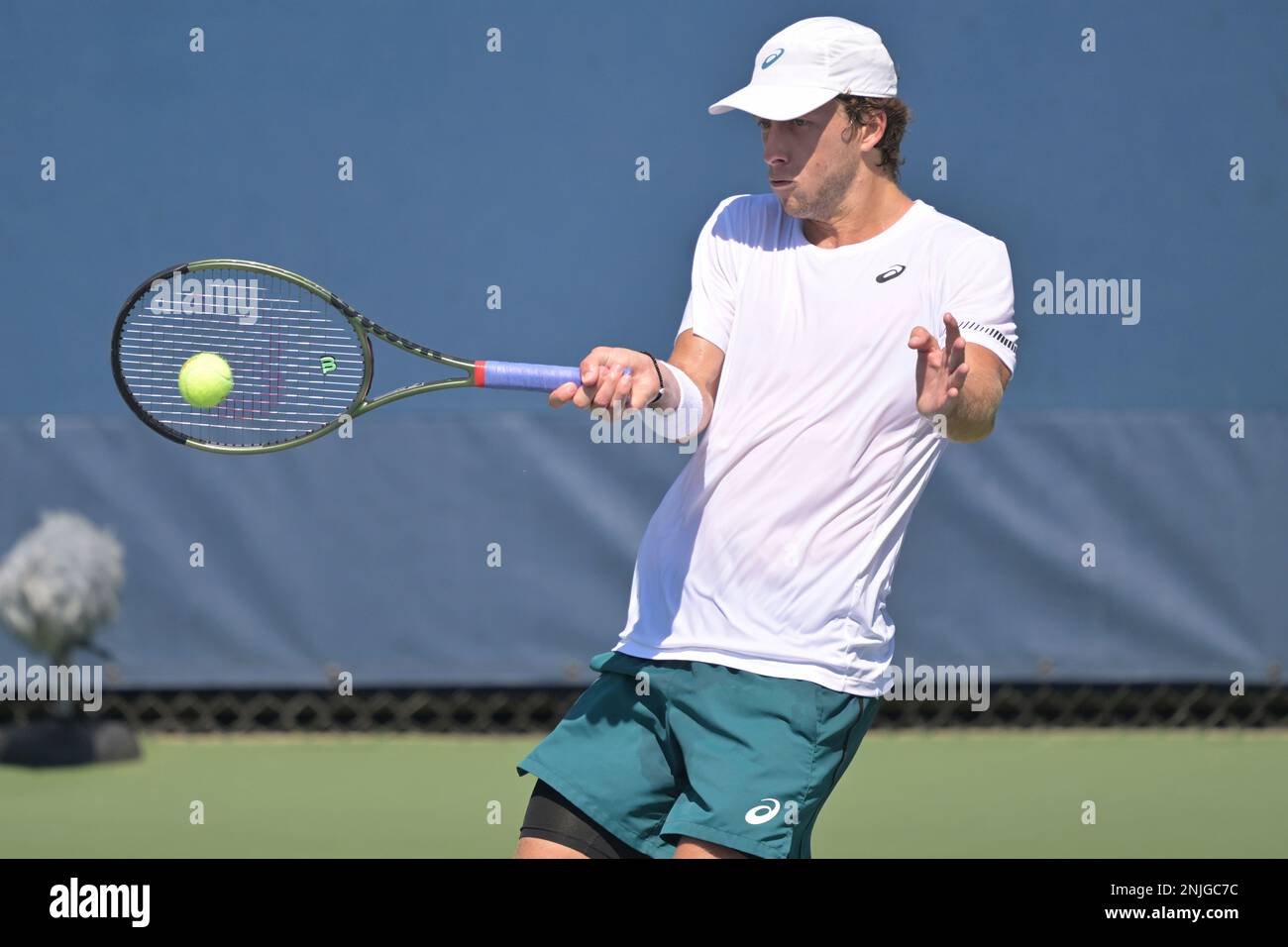 Brandon Holt hits a forehand during a Men's Qualifying Singles match at ...