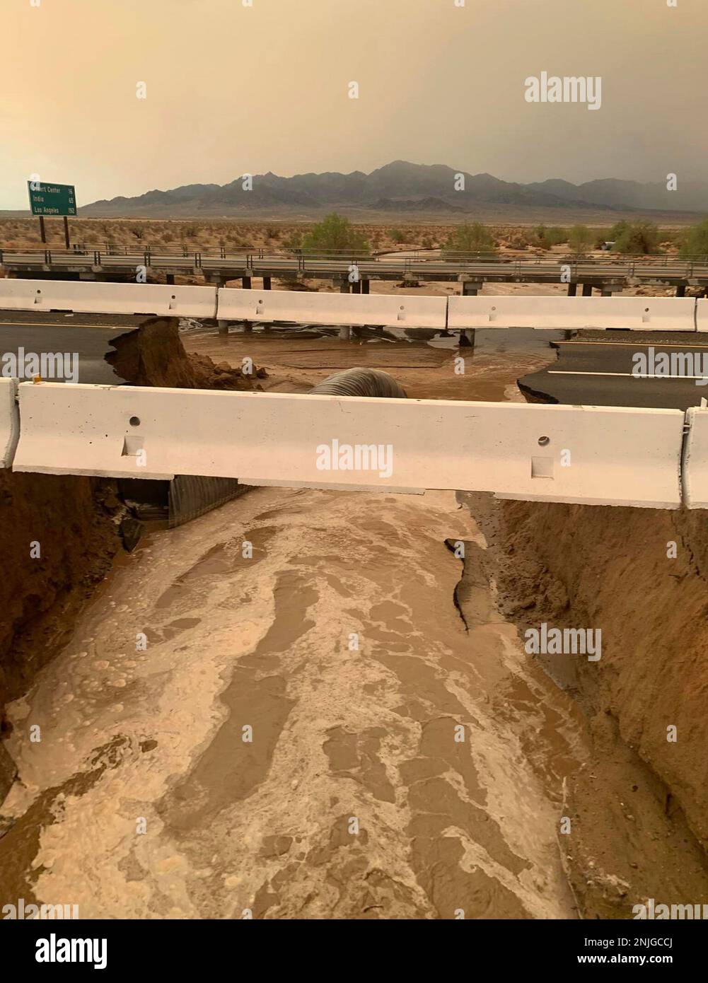 This photo provided by Caltrans shows a washed out section of ...