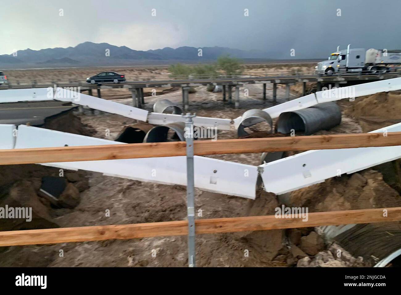 This photo provided by Caltrans shows a washed out section of ...