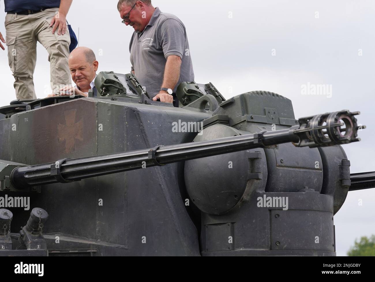 German Chancellor Olaf Scholz, center, looks out of a Gepard anti-aircraft gun tank as he visits ...