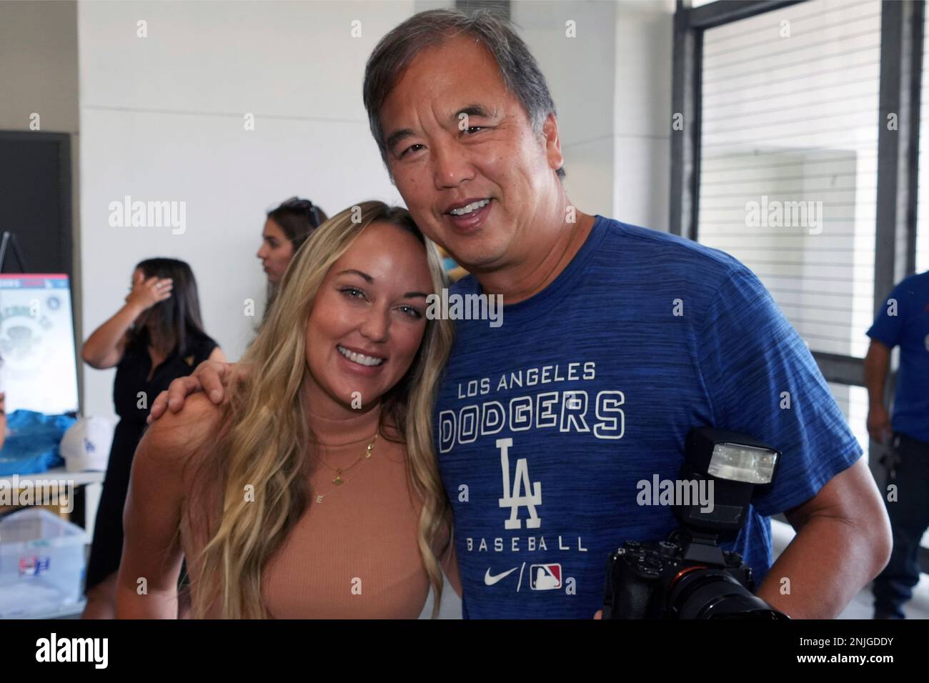 Los Angeles Dodgers photographer Jon Soo Hoo (right) poses at Miguel ...