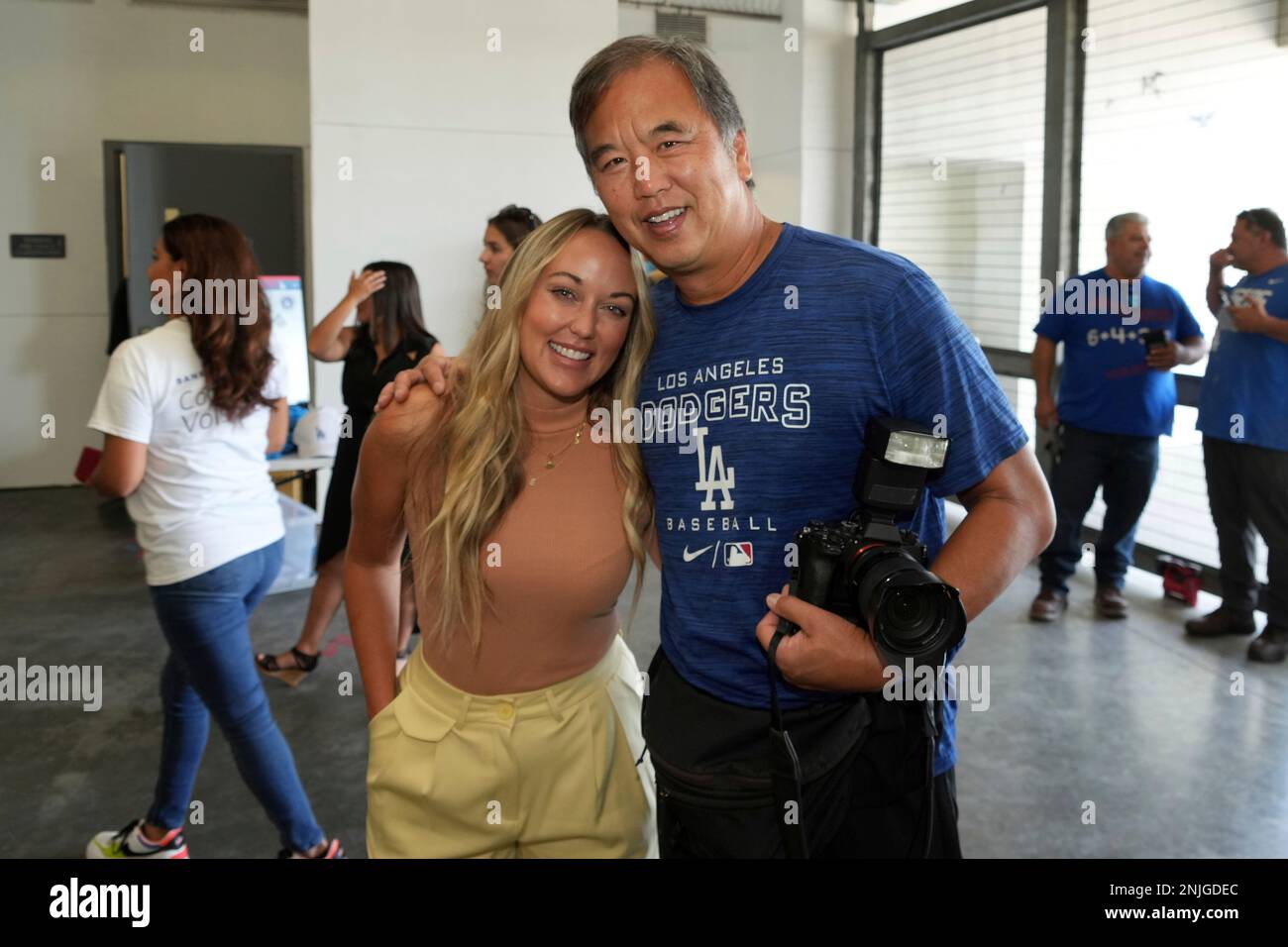 Los Angeles Dodgers photographer Jon Soo Hoo (right) poses at Miguel ...