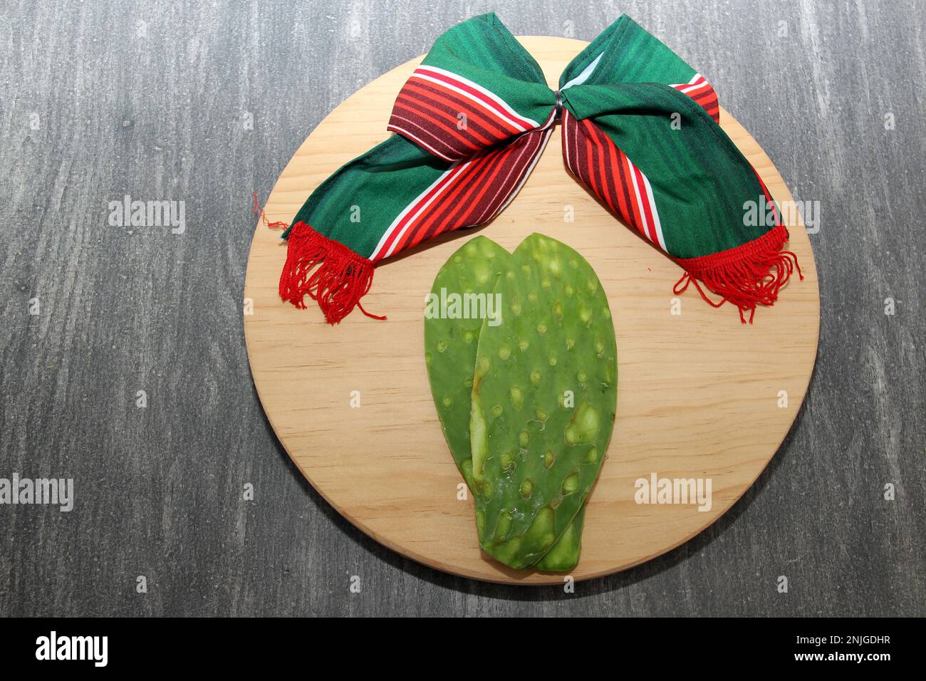 Festive Mexican objects: handmade doll and tricolor tie bow next to ...