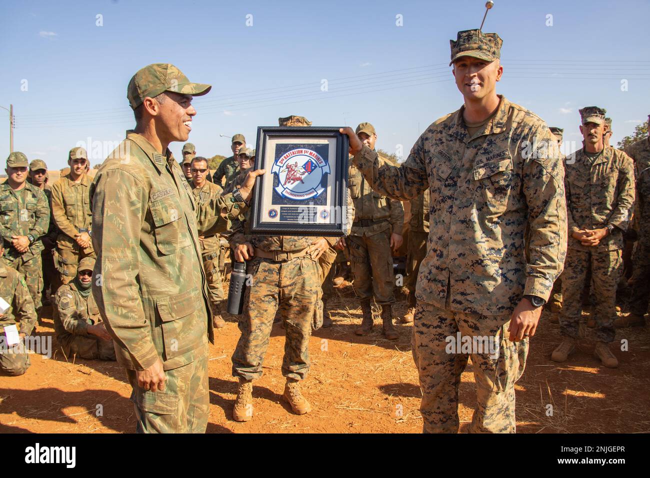 U.S. Marine Corps Capt. Jared Griffith (right), commanding officer ...