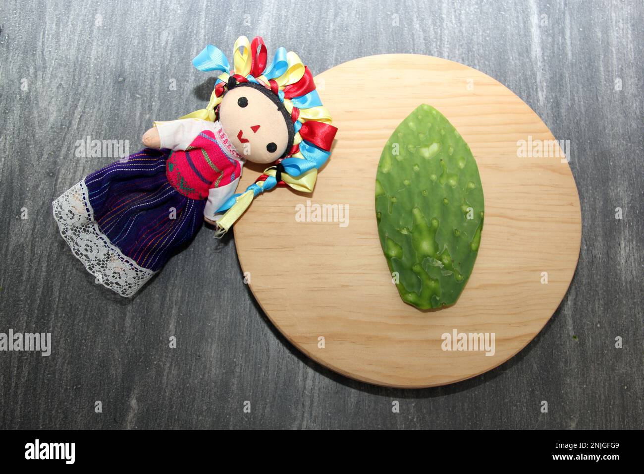 Festive Mexican objects: handmade doll and tricolor tie bow next to ...