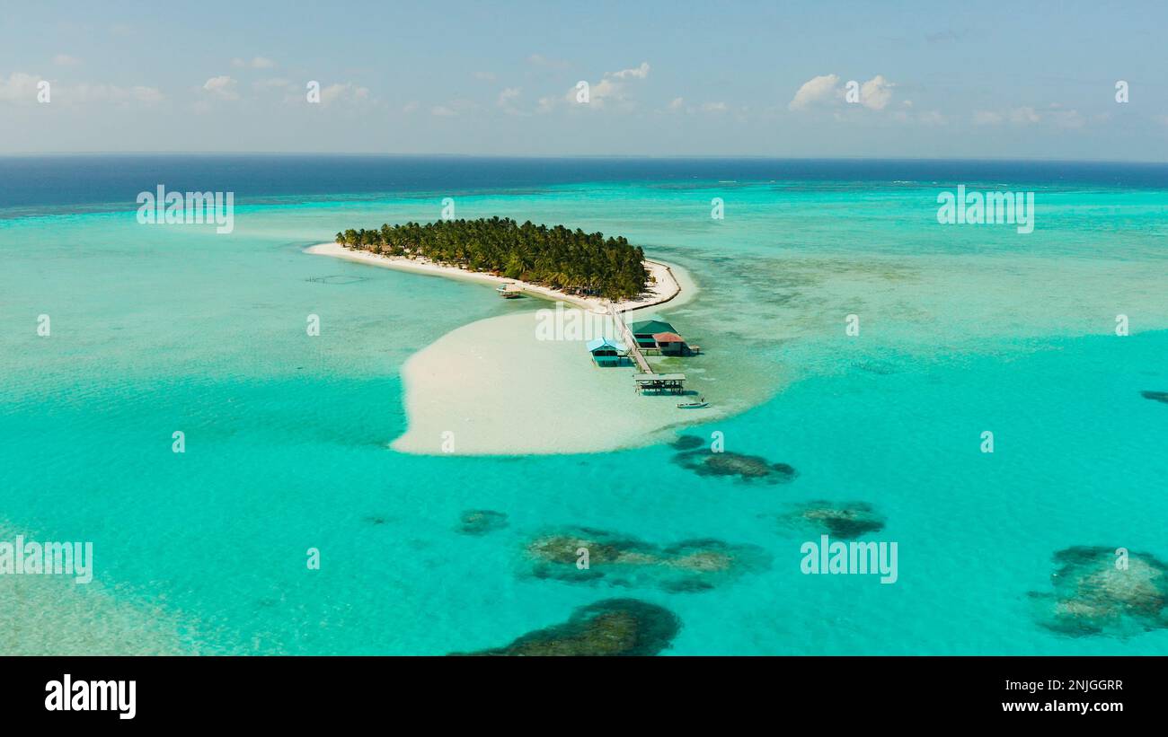 Tropical island with beautiful beach, palm trees and turquoise water ...