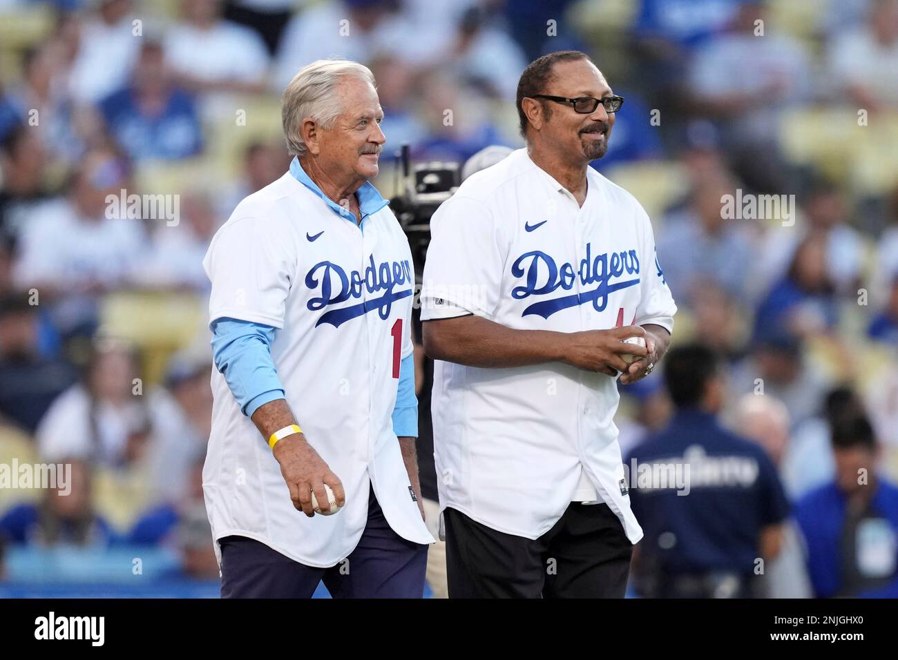 Rick Dempsey (left) and Ken Landreaux prepare to throw out the ...