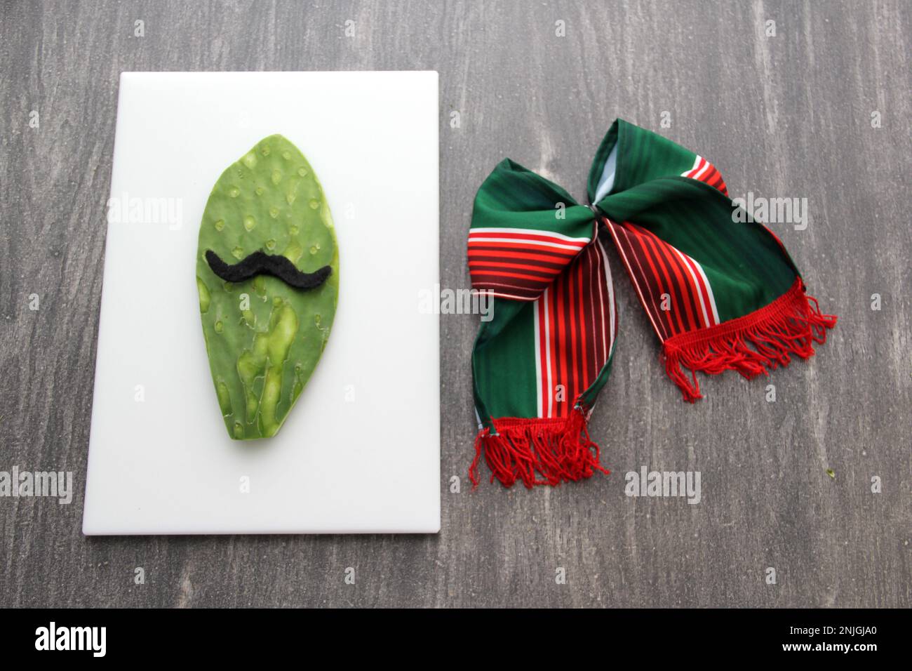 Nopal face with mustache and bow tie festive mexican style on wooden ...