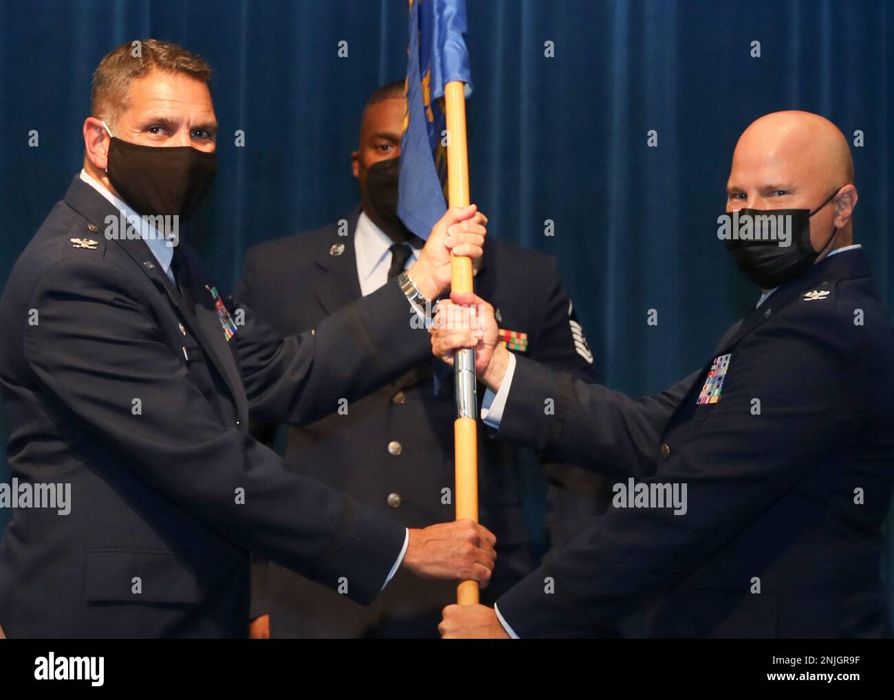 Col. Raymond A. Smith Jr., 445th Airlift Wing commander, passes the ...