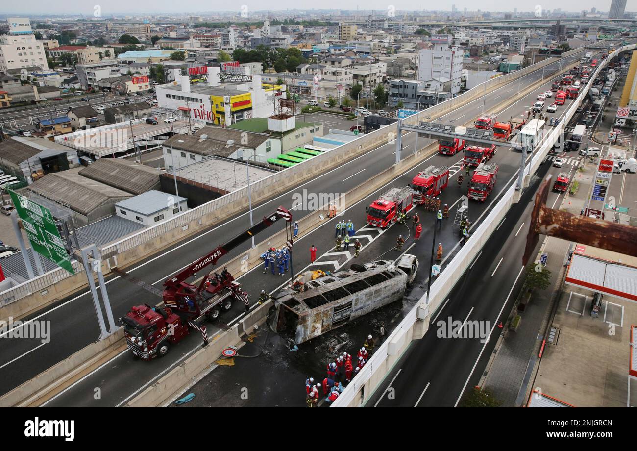 A photo shows a bus overturned and caught fire on NAGOYA EXPRESSWAY in ...