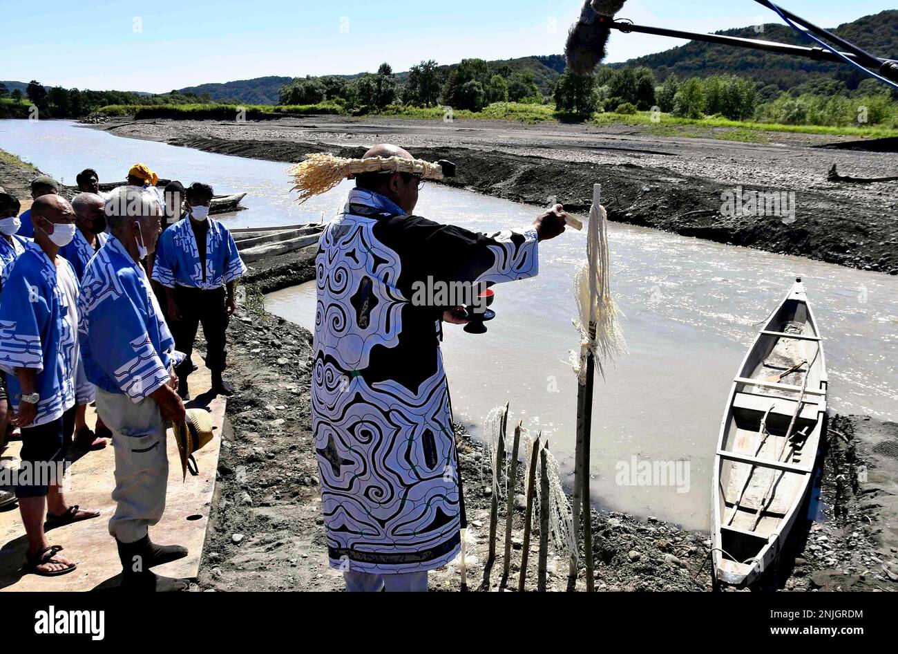 An Ainu traditional ritual " Chipusanke" meaning a boat launching takes ...