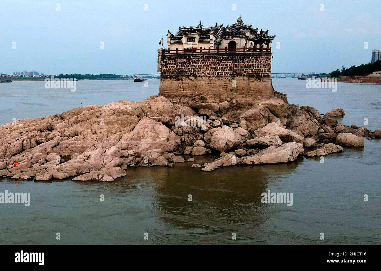 A view of the 700-year-old Guanyin Temple, built on a rock in the ...