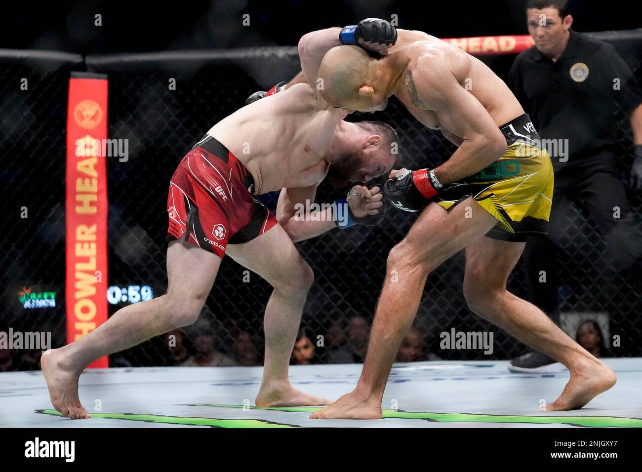 UFC bantamweight fighter José Aldo of Brazil, right, fights Merab ...