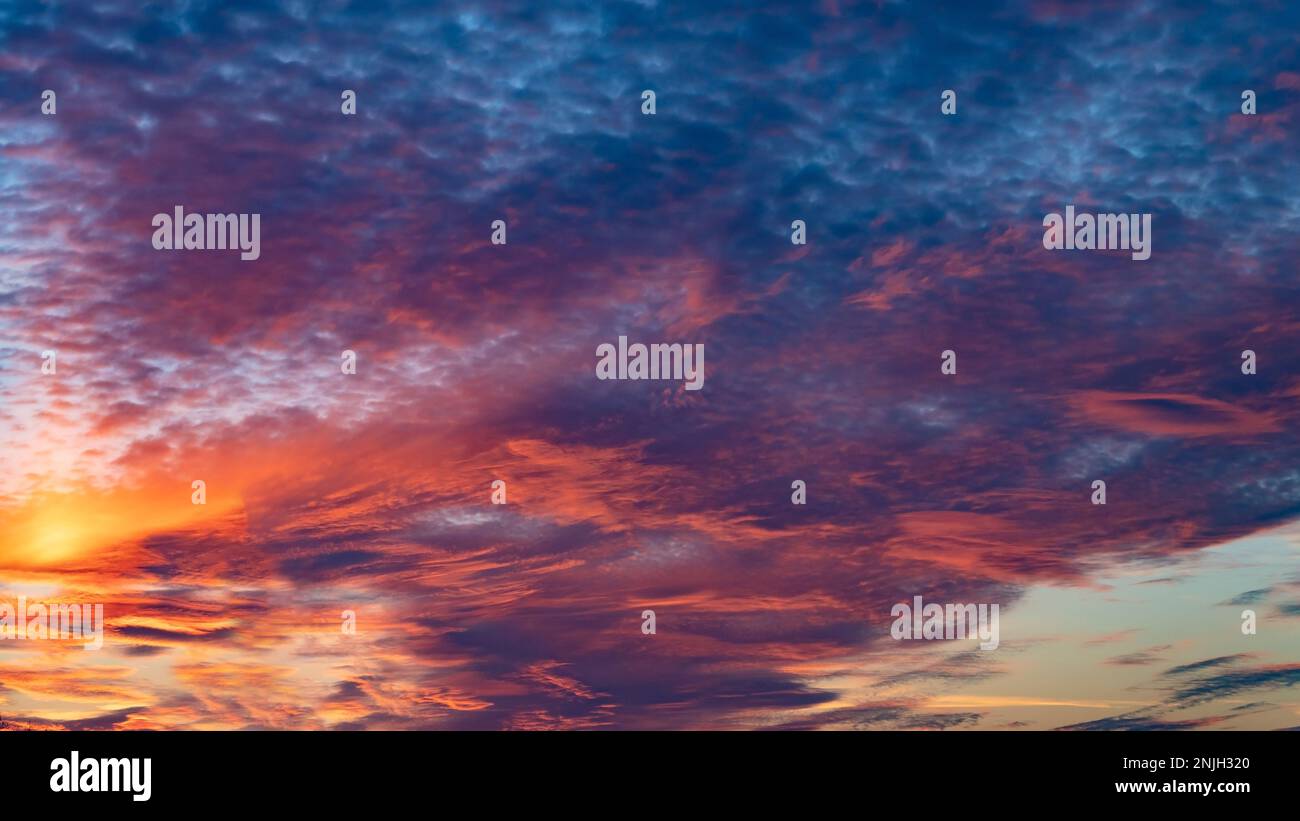 Sunset sky. Cirrocumulus and cirrostratus clouds during sunset ...