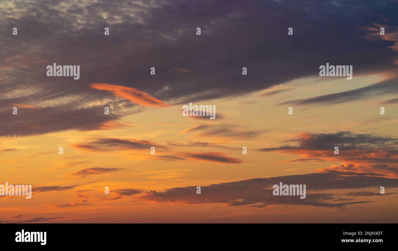 Sunset sky. Cirrocumulus and cirrostratus clouds during sunset ...