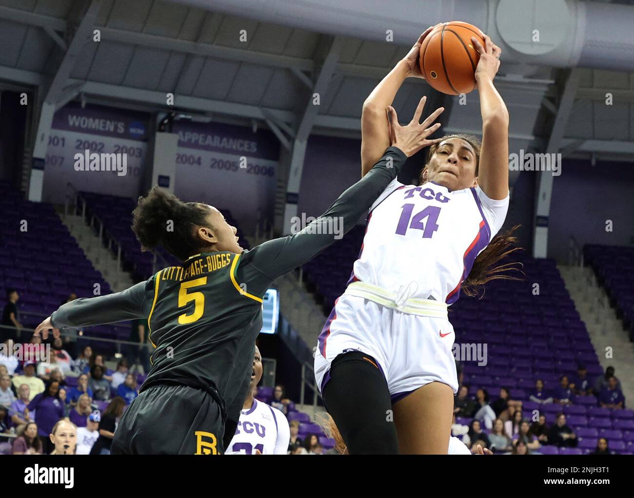 TCU forward Bella Cravens (14) pulls down a rebound over Baylor guard ...